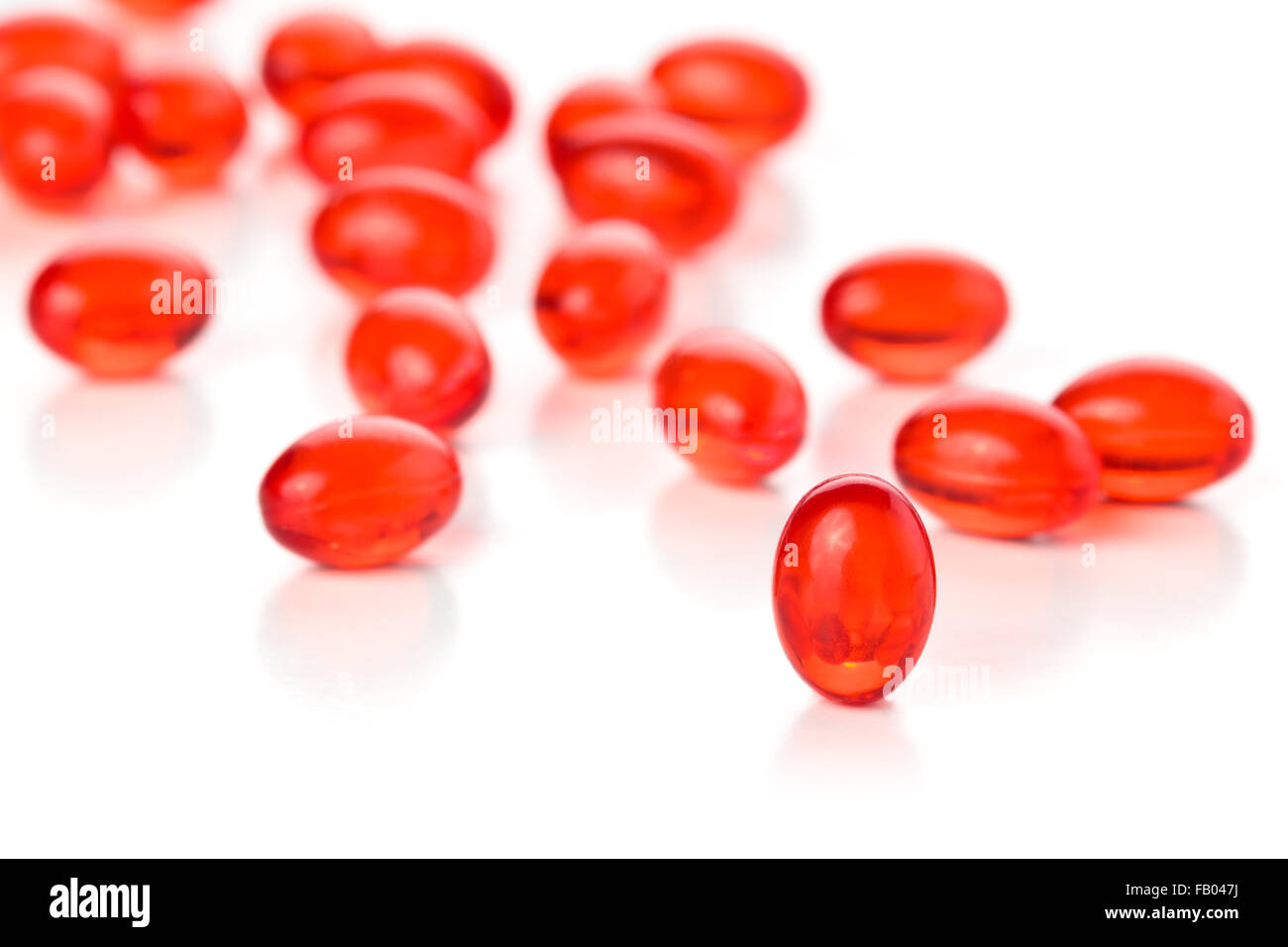 Close up shot of red capsules Stock Photo - Alamy