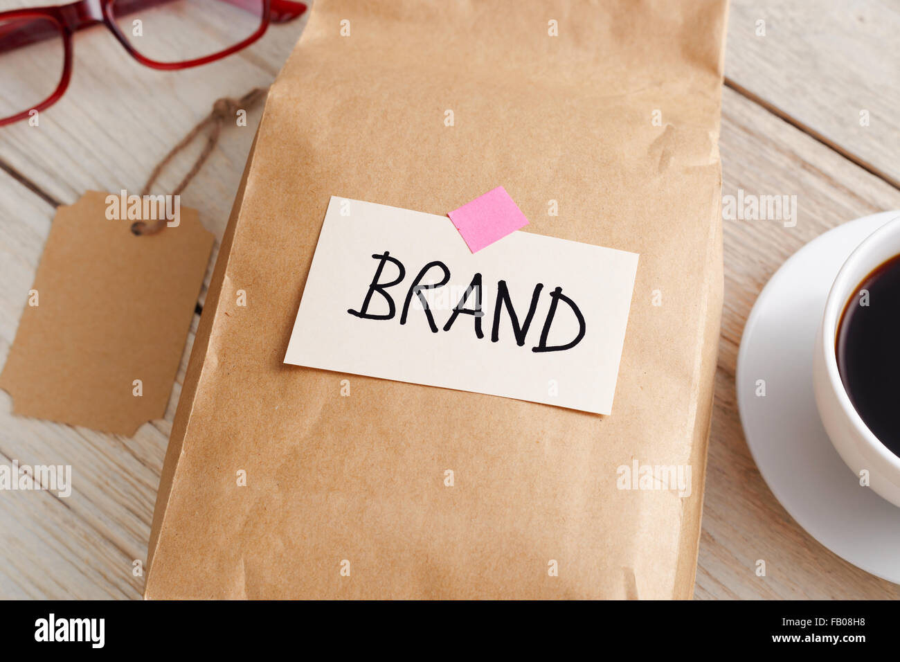 Brand marketing concept with product paper bag, brand tag on wood desk ...