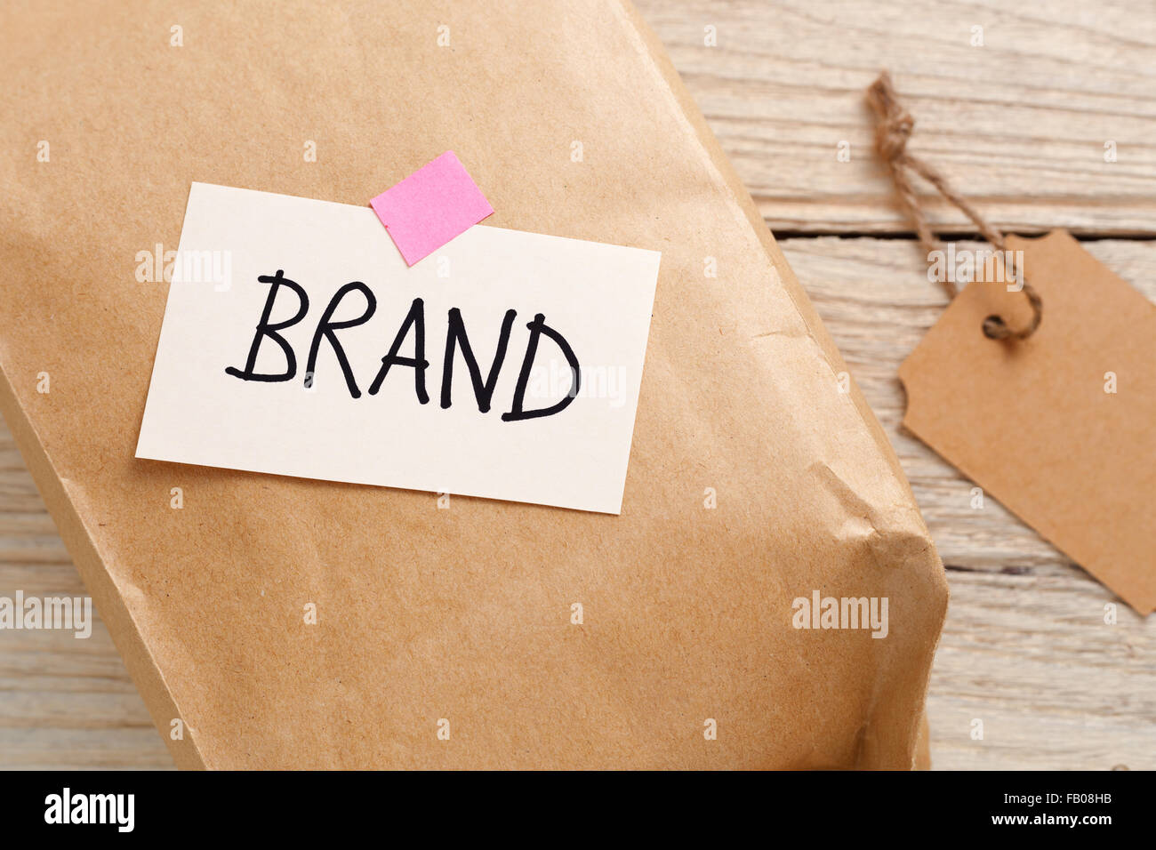 Brand marketing concept with product package, brand tag on wood desk ...