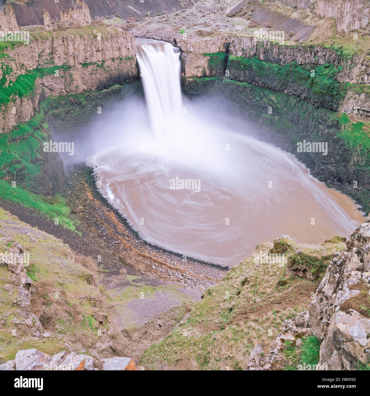 palouse falls spilling into a plunge pool in a deep canyon of the ...