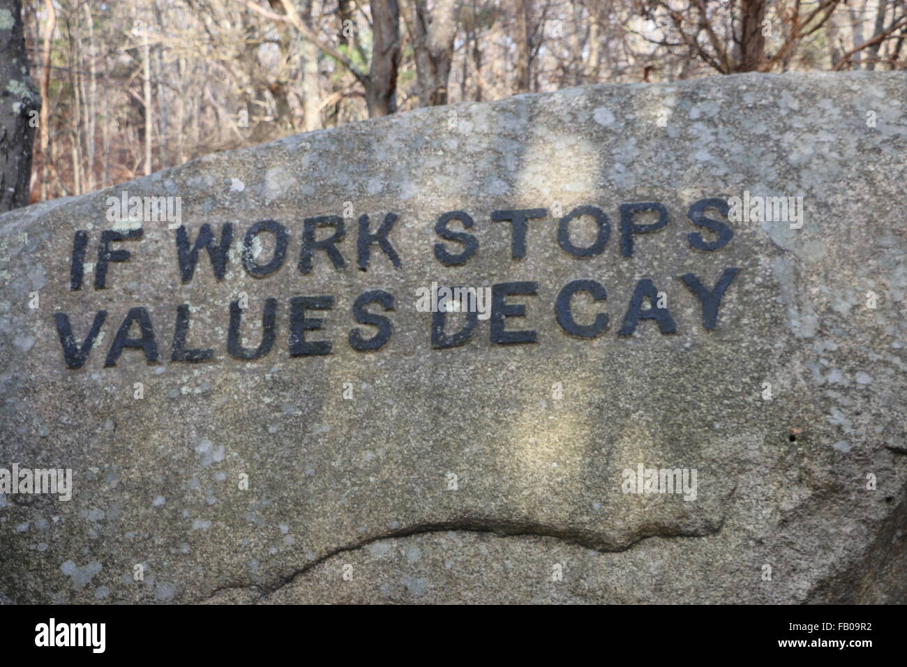 If Work Stops Values Decay carved stone messages on a granite boulder ...