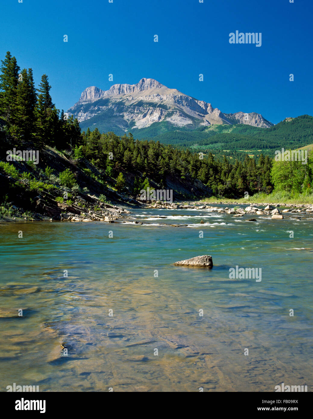 sun river below sawtooth ridge along the rocky mountain front near ...