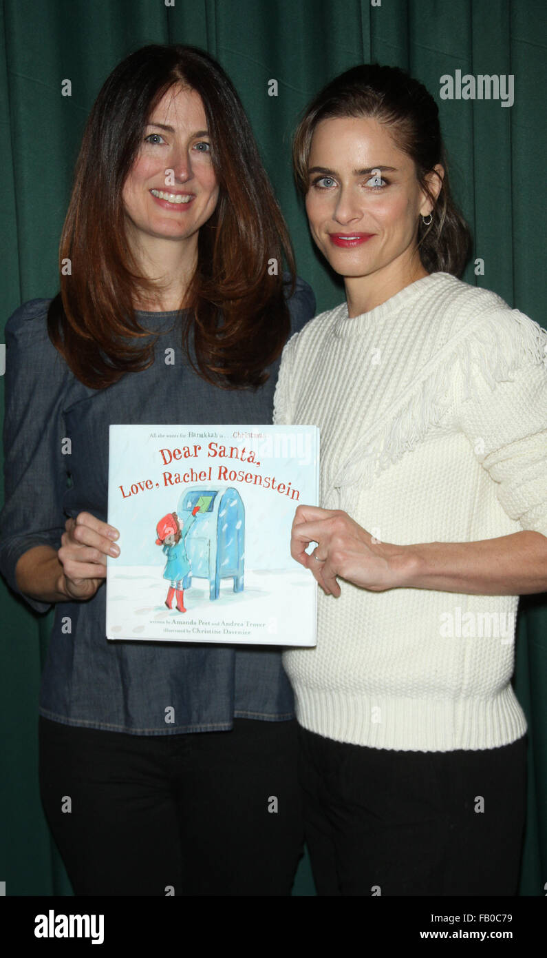 Author Andrea Troyer and actress Amanda Peet sign copies of their book ...