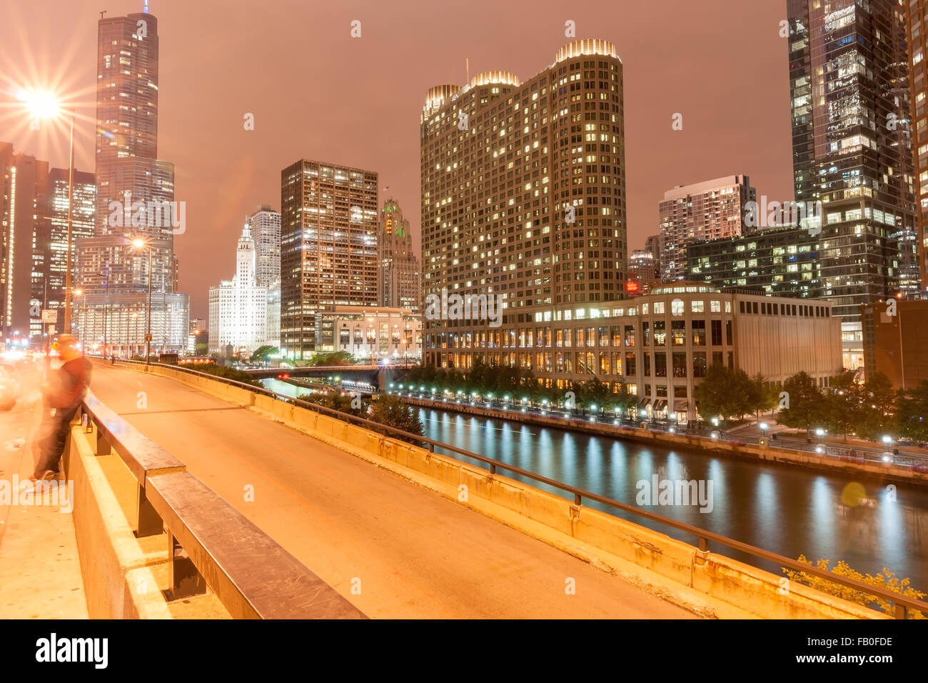 Chicago buildings, illuminated towering into dark night sky urban roads ...