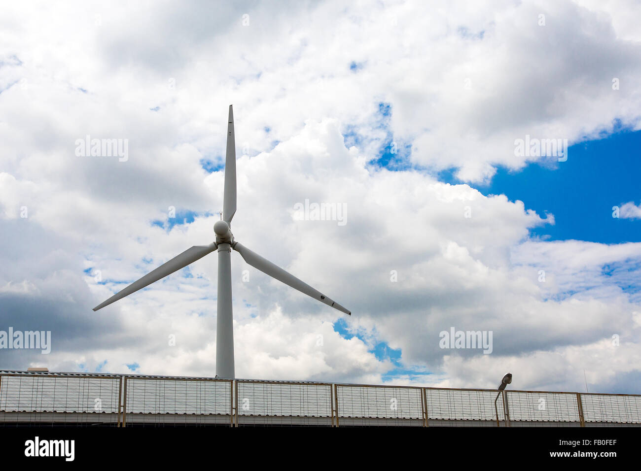 Wind energy generator with rotating blades Stock Photo - Alamy