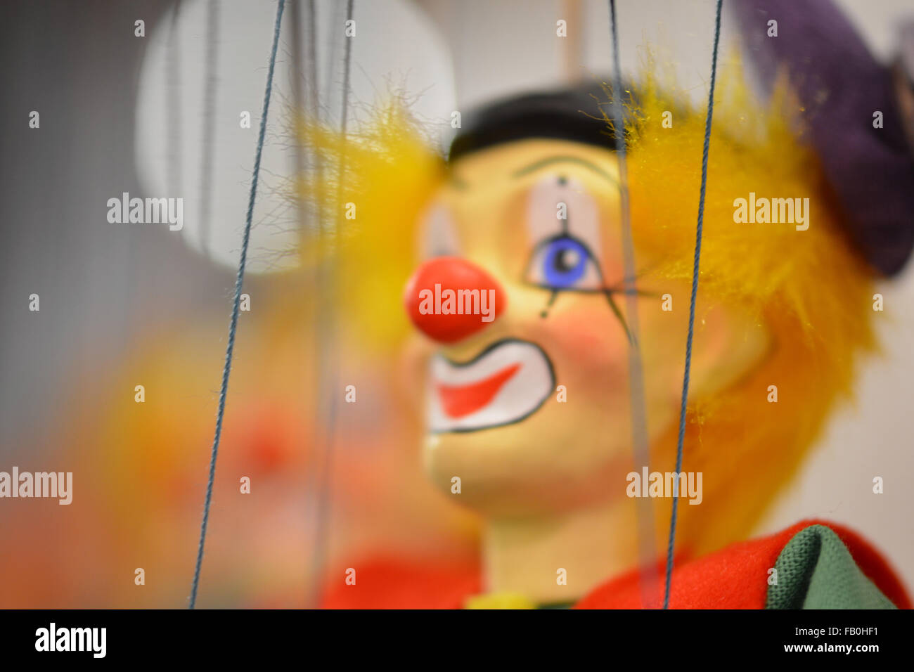 Old Blue Eyes - brightly coloured string puppet Stock Photo - Alamy