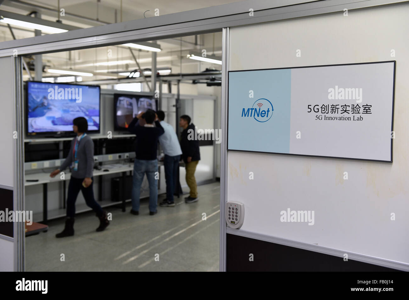 Beijing, China. 7th Jan, 2016. Staff members work at the 5G Innovation ...