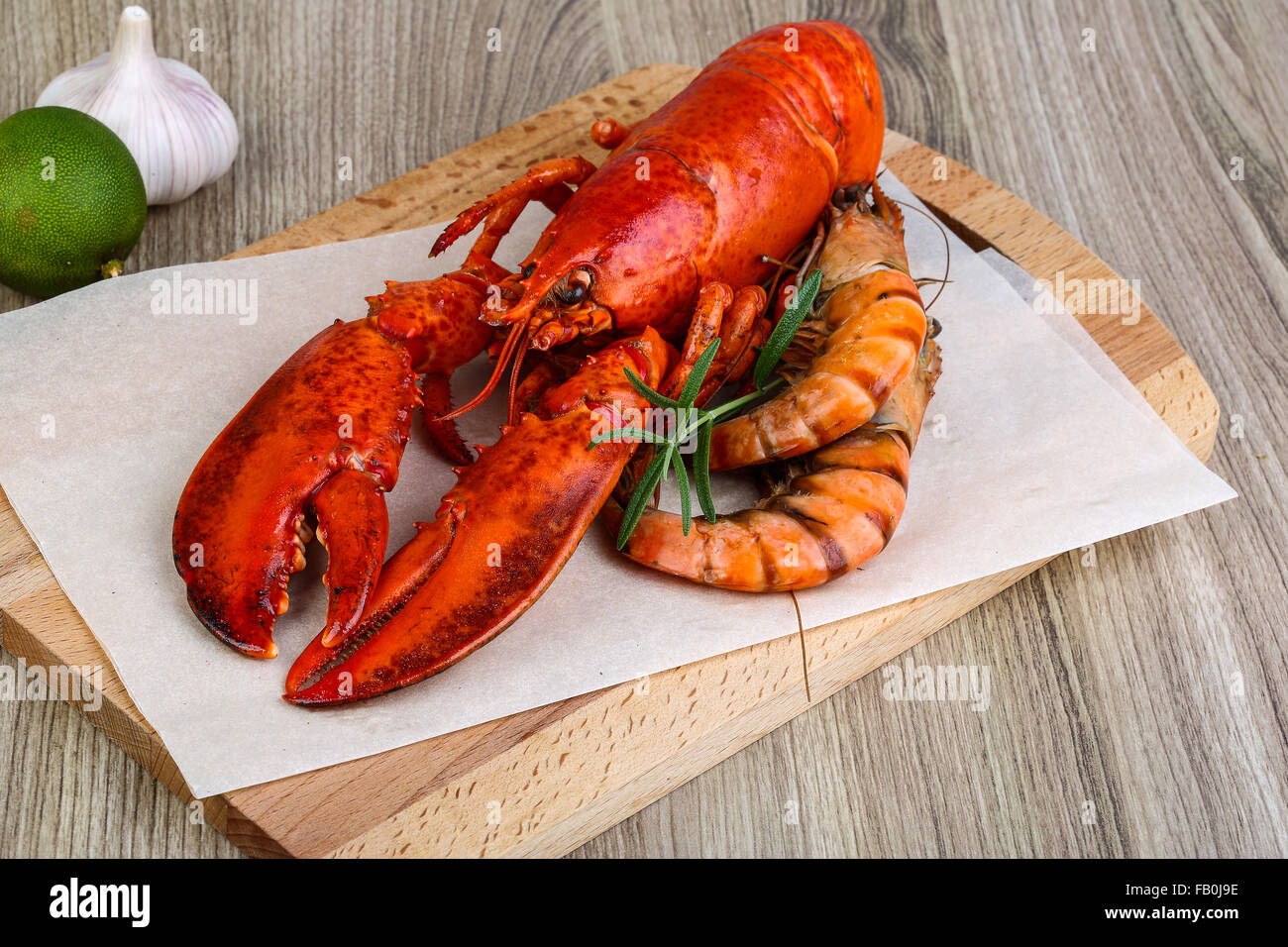 Big cooked lobster and tiger shrimps ready for eating Stock Photo - Alamy