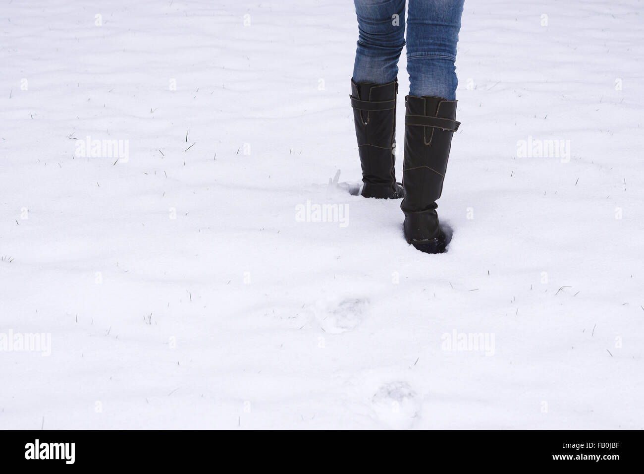 boots trudging through snow Stock Photo - Alamy