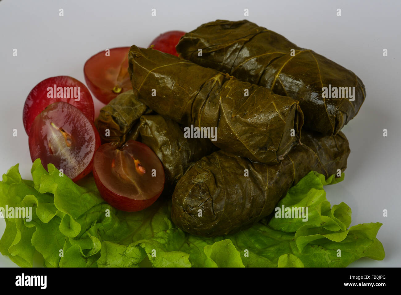Dolma - minced meat in grape leaves with salad Stock Photo - Alamy