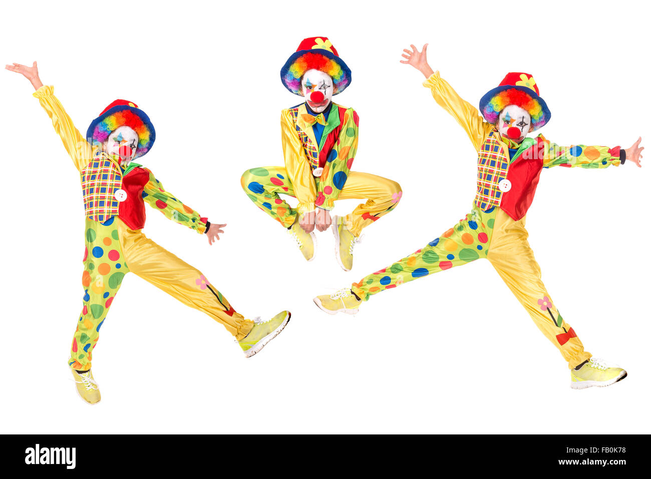 Young girl with clown costume jumping isolated in white Stock Photo - Alamy