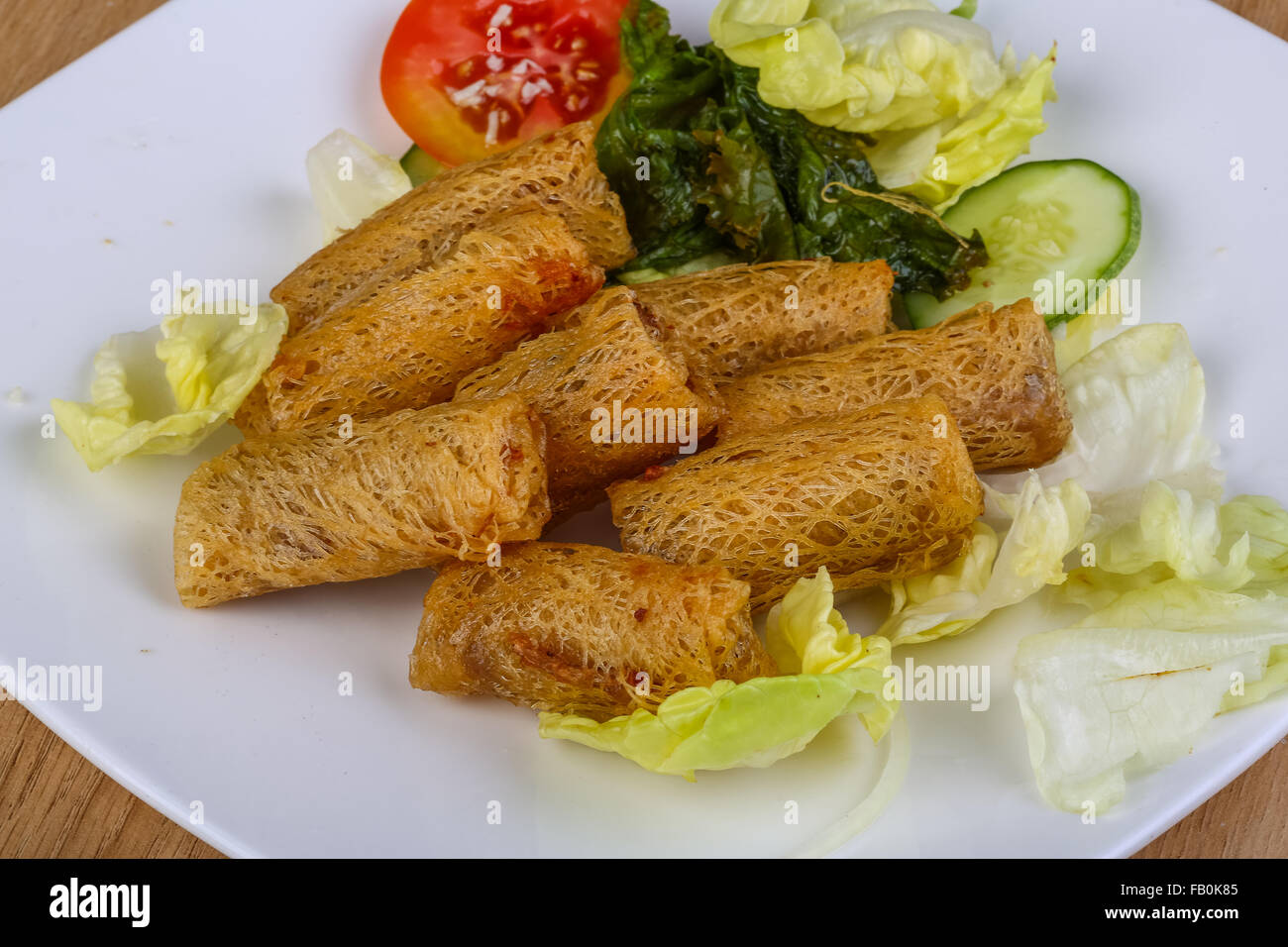 Asian traditional spring rolls on the wood background Stock Photo - Alamy
