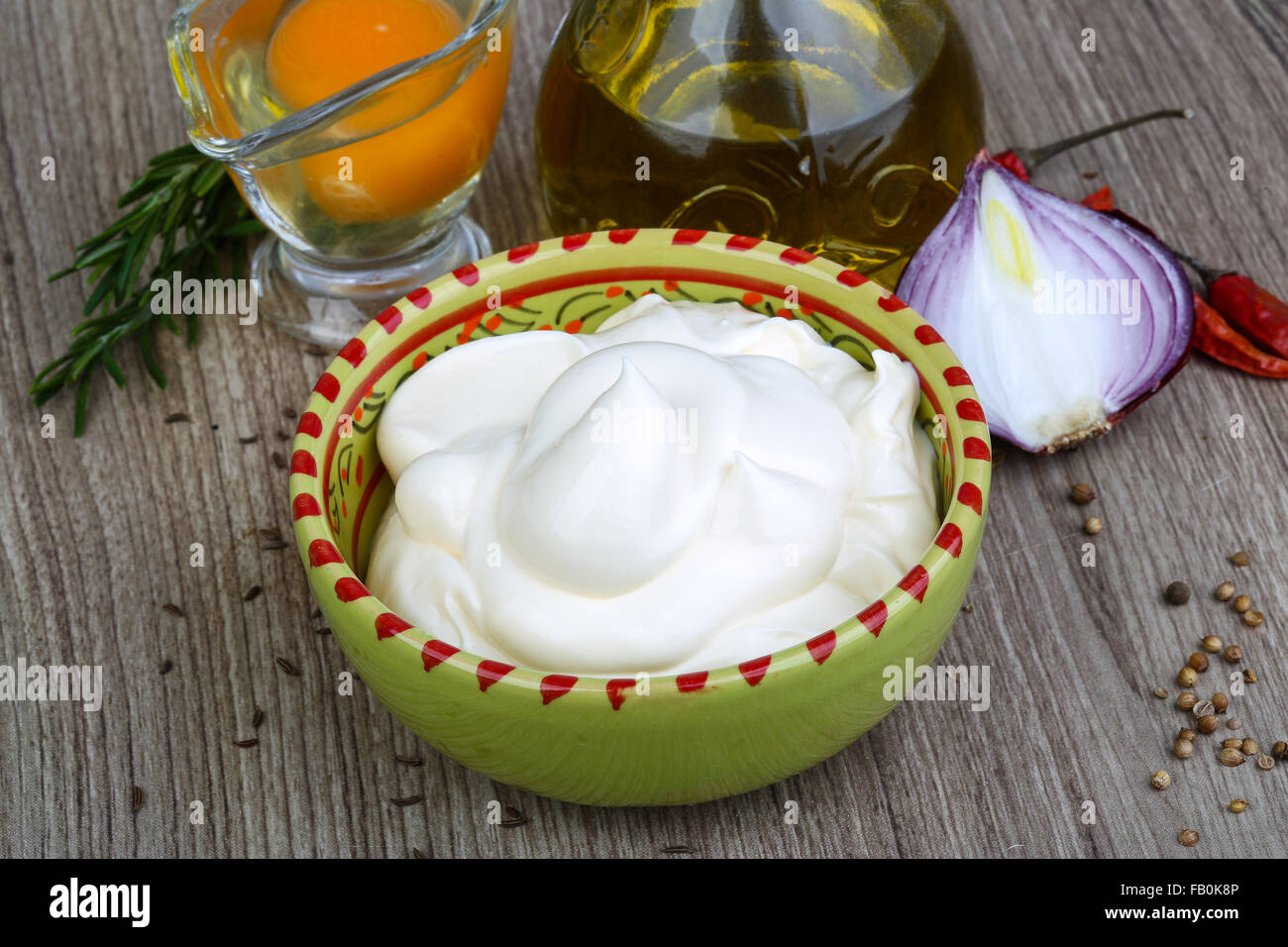 Mayonnaise sauce served raw egg, olive oil and rosemary Stock Photo - Alamy