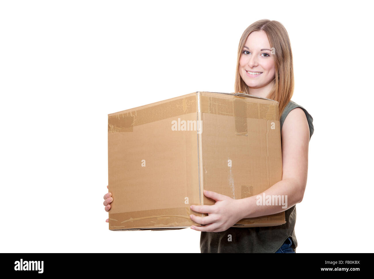 Attractive young woman carrying moving boxes Stock Photo - Alamy