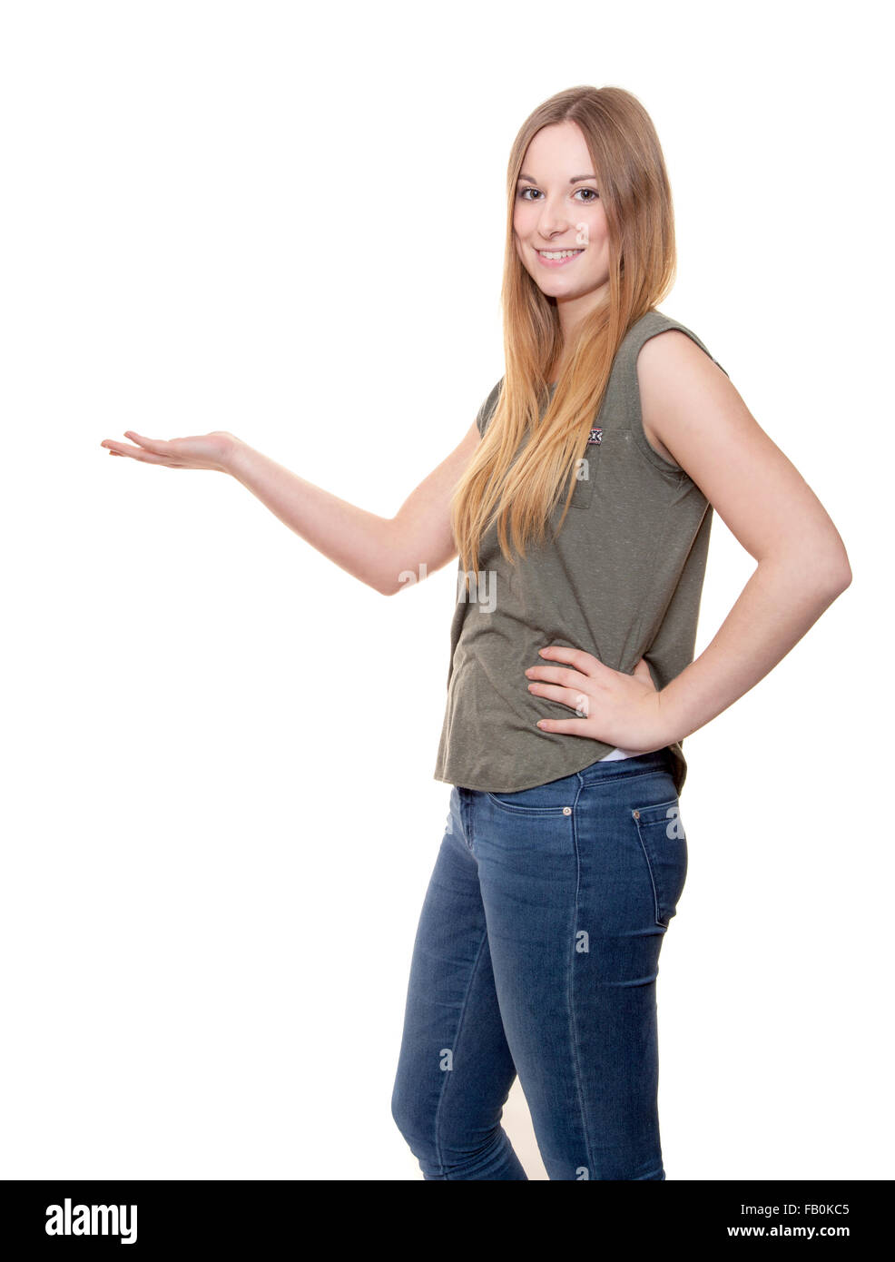 Attractive young woman pointing to the side. All on white background ...
