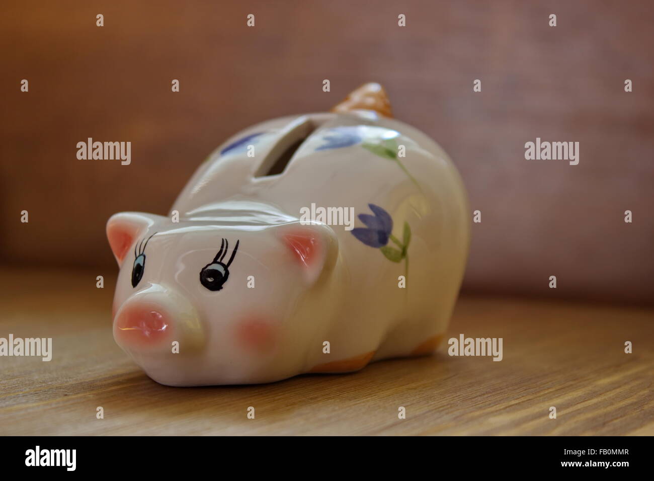 Porcelain painted money pig, piggy bank Stock Photo - Alamy