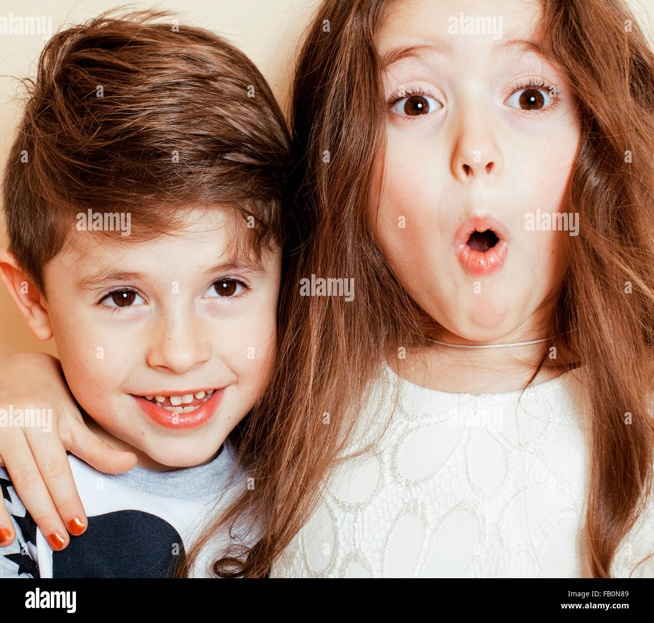 little cute boy girl hugging playing on white background, happy family ...