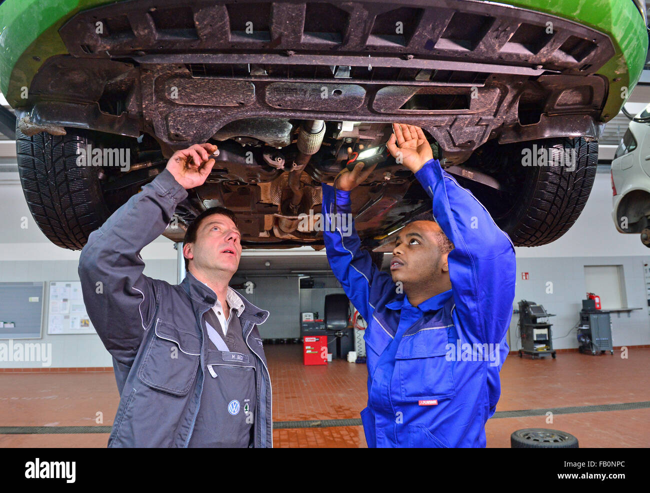Nordhausen, Germany. 07th Jan, 2016. Refugee Michael Telcom (R) froom ...