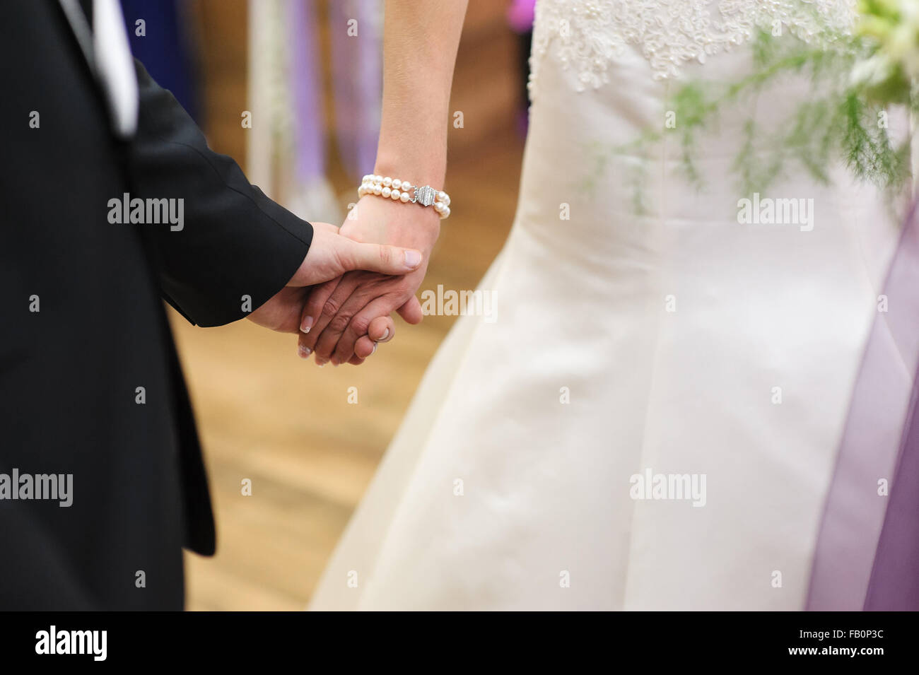 Bride and groom's hands Stock Photo - Alamy