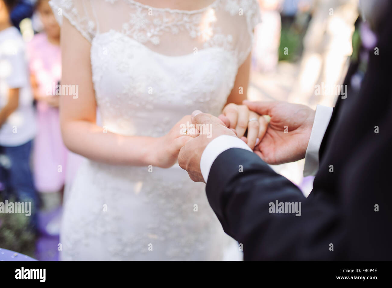 Two hands holding rings hi-res stock photography and images - Alamy