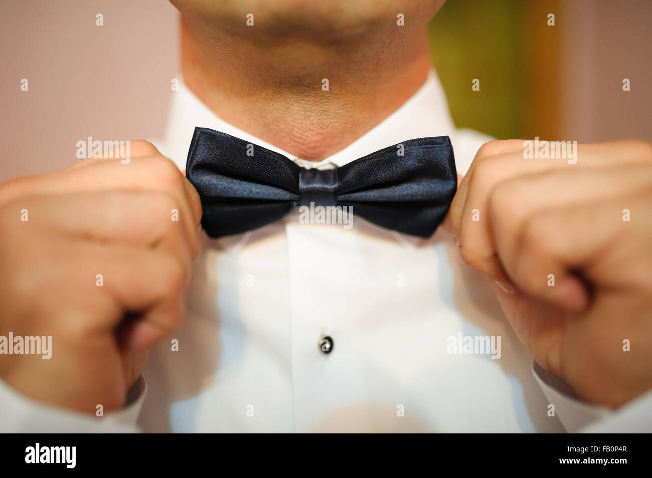 Bowtie adjustment hi-res stock photography and images - Alamy