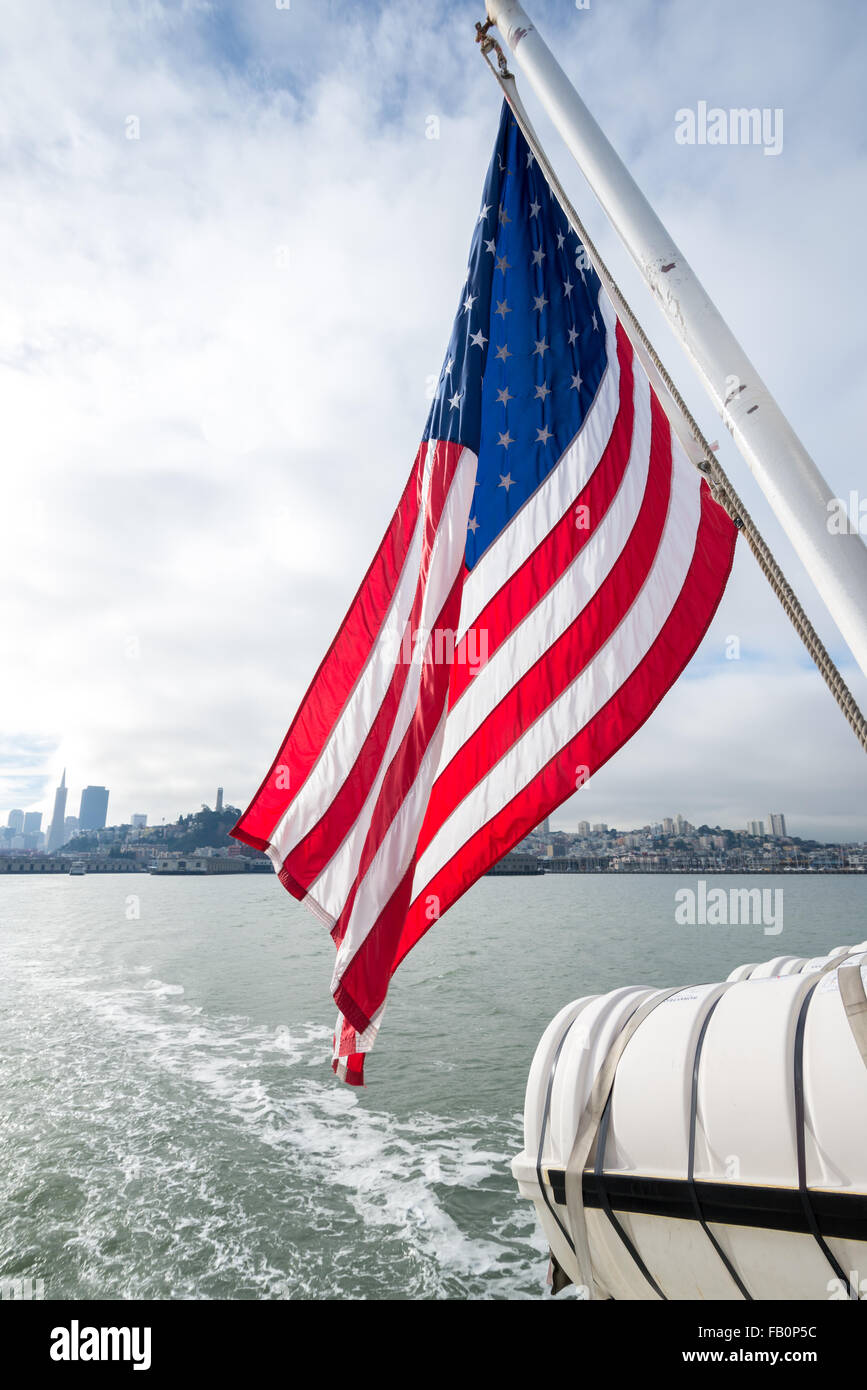 American flag with San Francisco skyline in distance Stock Photo - Alamy