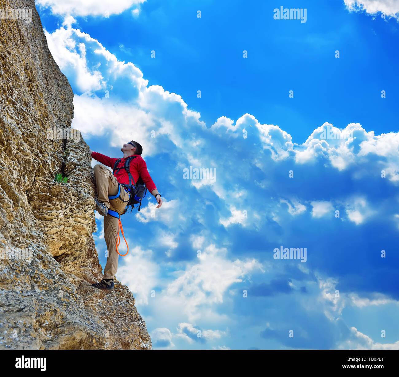 Man climbing on rock hi-res stock photography and images - Alamy