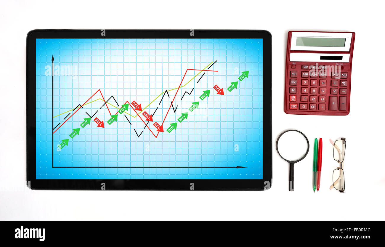 touch pad with stock chart on workplace Stock Photo - Alamy