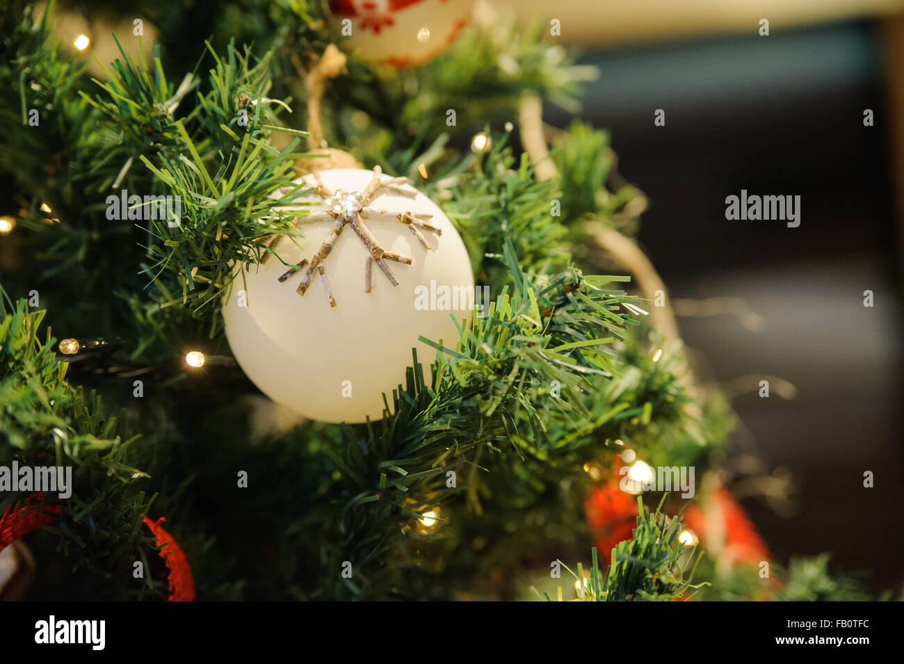 white Christmas ornament hanging on a tree branch Stock Photo - Alamy