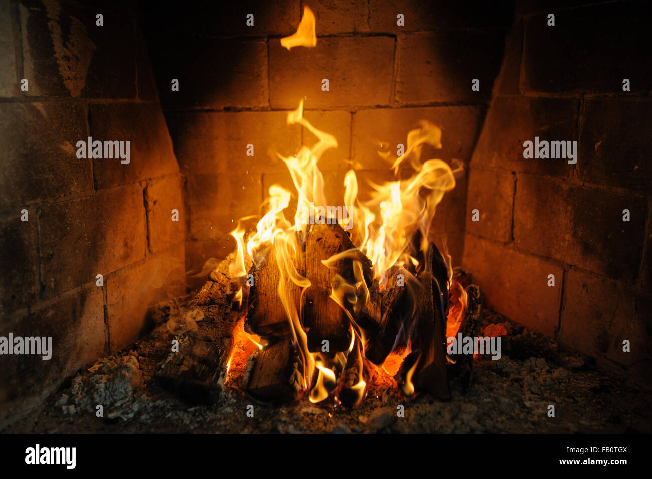 fire in fireplace and flames dance Stock Photo - Alamy