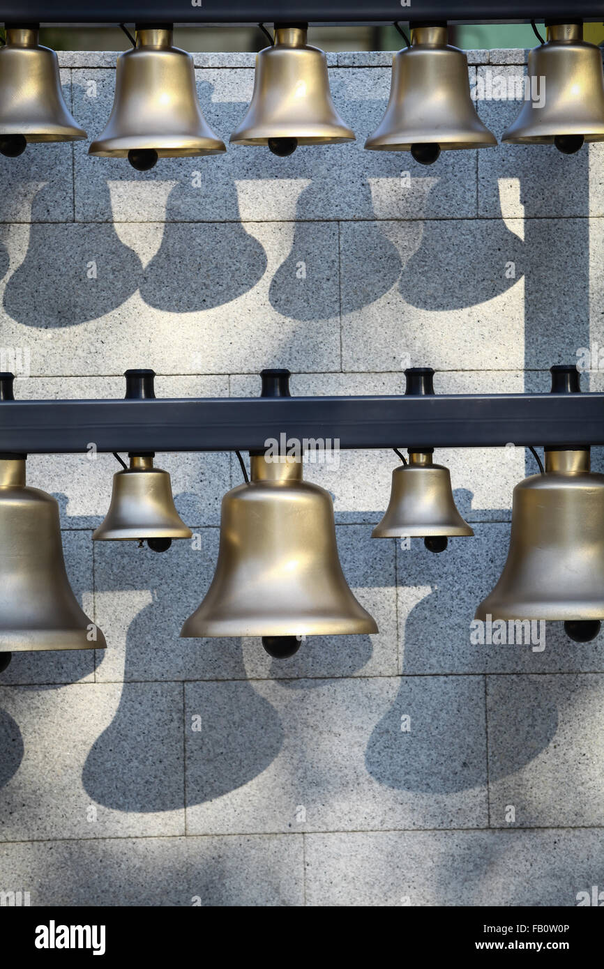 Color image of some various sized bells in a row Stock Photo - Alamy