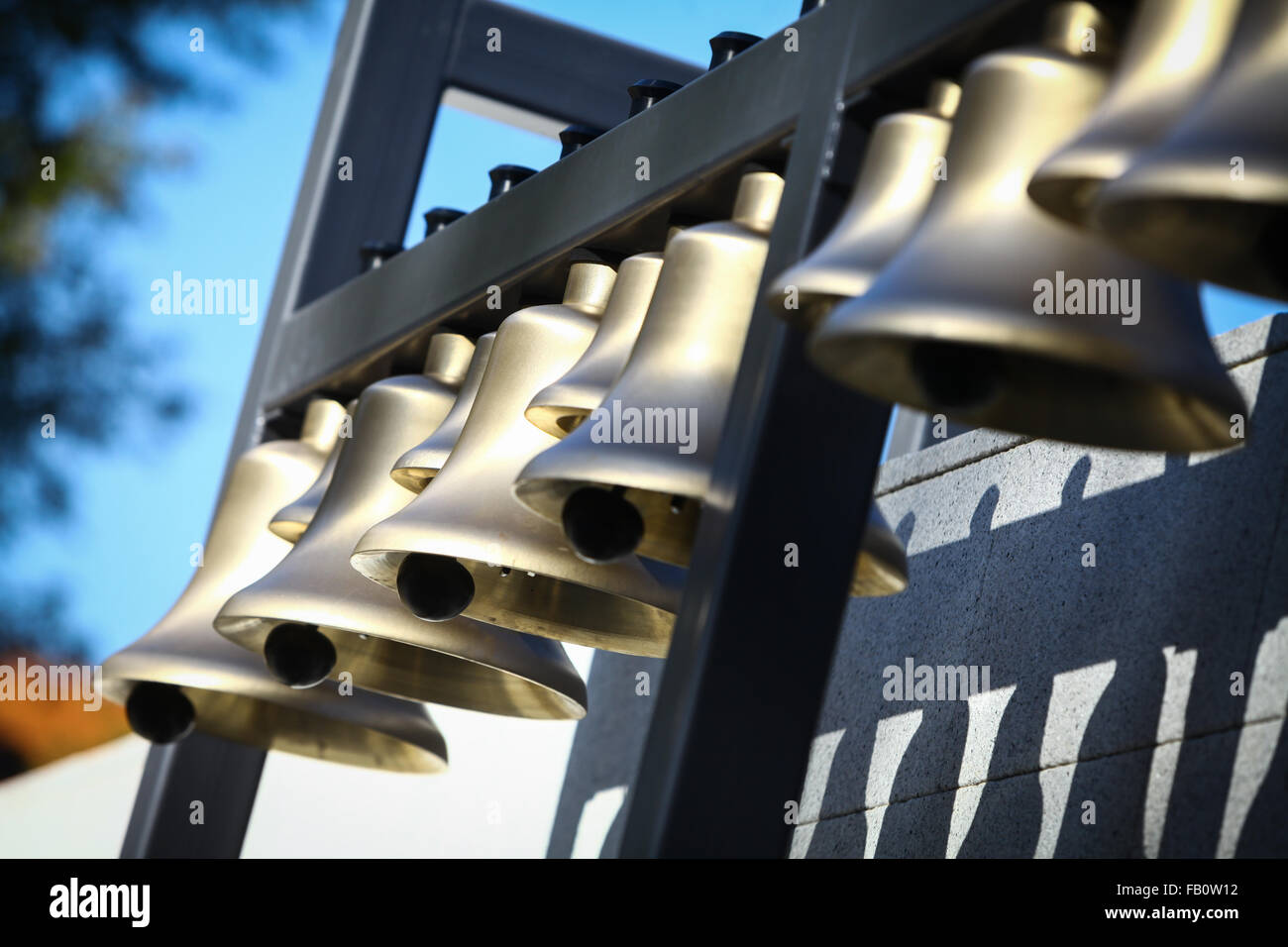 Color image of some various sized bells in a row Stock Photo - Alamy