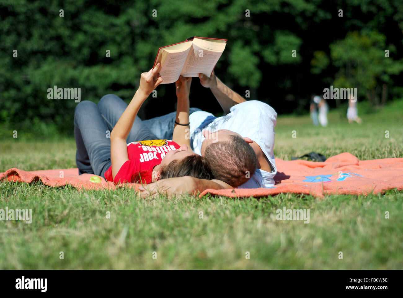 Beautiful, Happy Couple Having Picnic and Reading Outside Stock Photo ...
