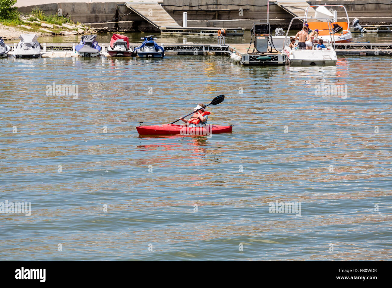 Woman in Red Kayak in lake Stock Photo - Alamy