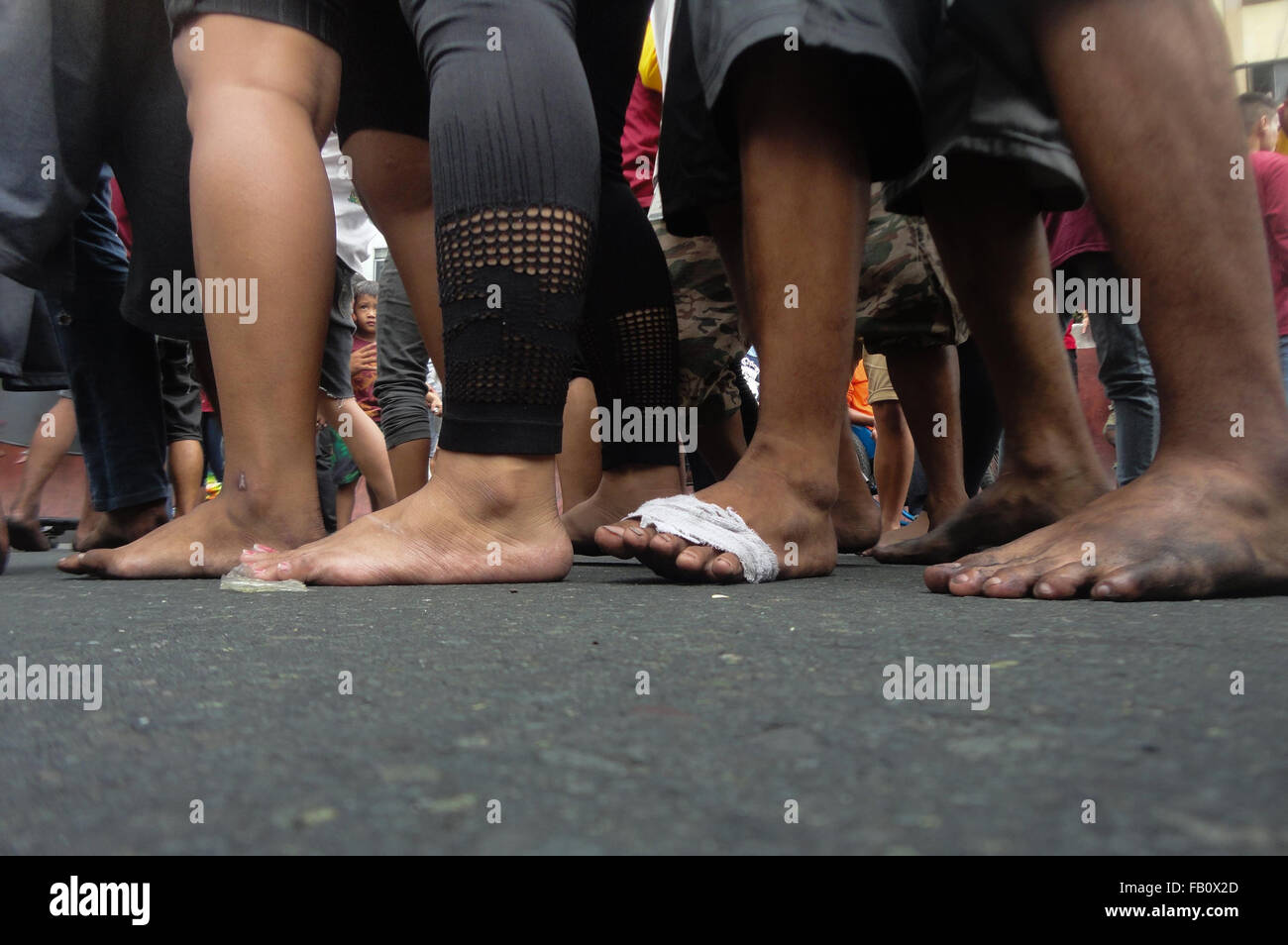 Manila, Philippines. 07th Jan, 2016. Barefoot Filipino devotees ...