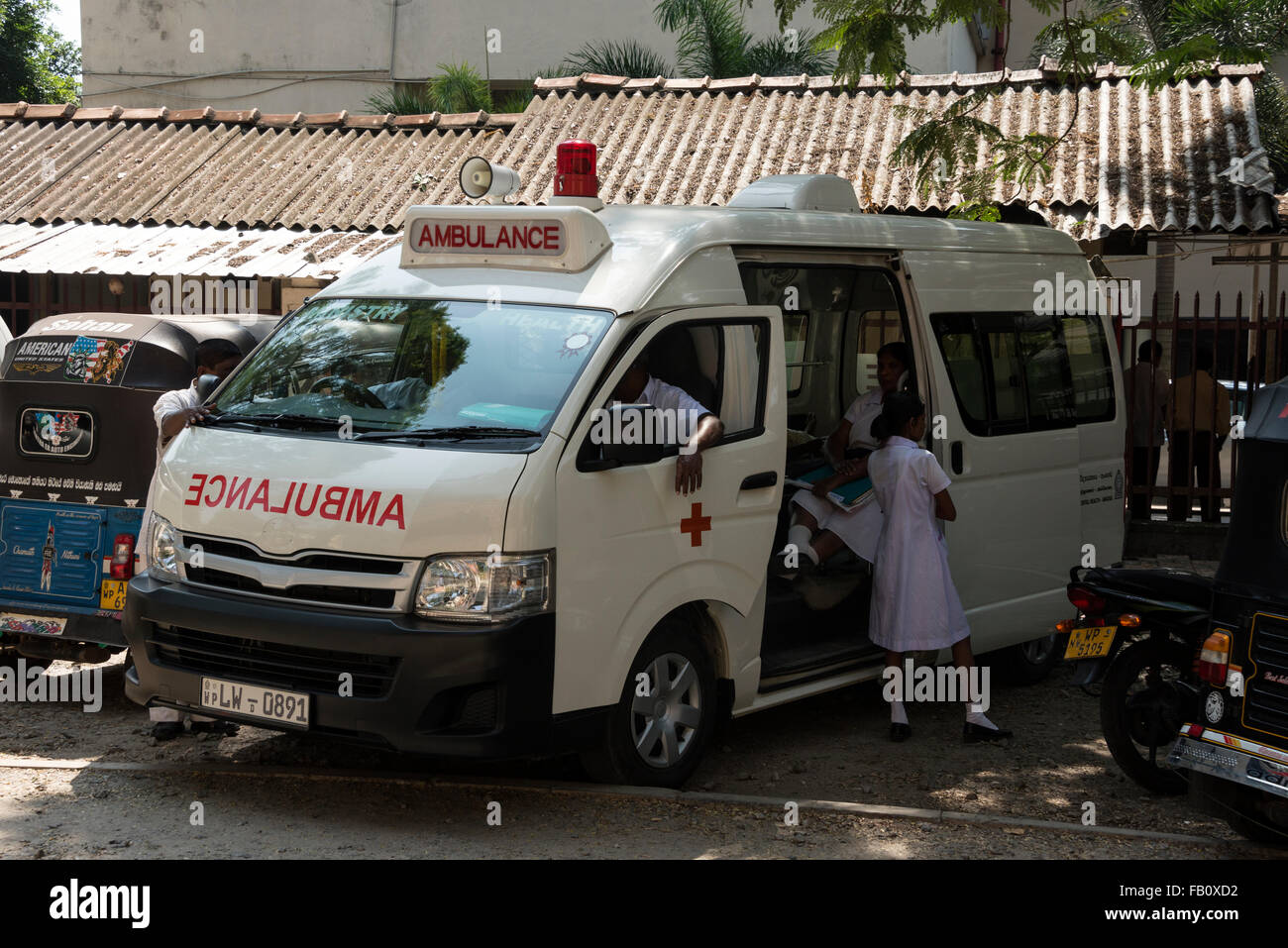 An ambulance crew relaxing in their parked ambulance in the vicinity of ...