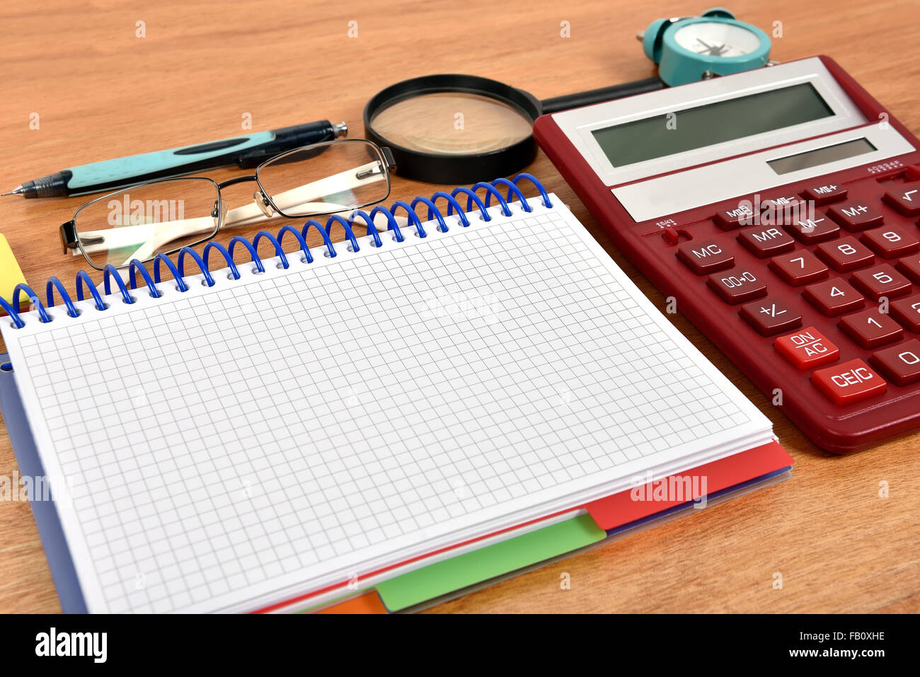 Notebook magnifying pen on work desk hi-res stock photography and ...