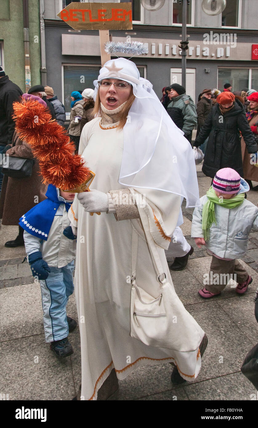 Young woman singing carols, walking at Epiphany (Three Kings ...