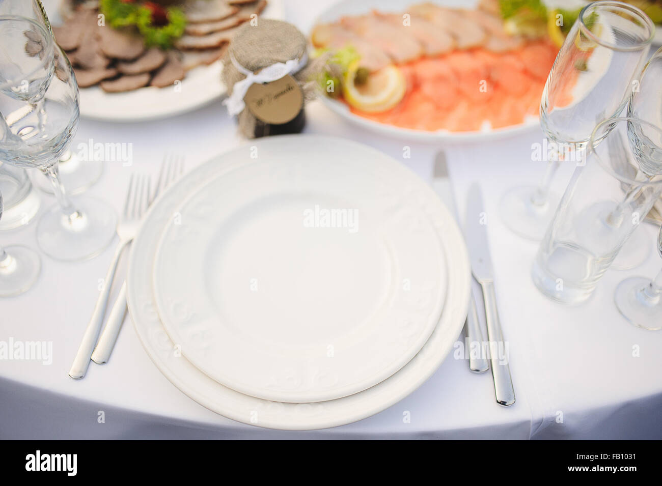 Banquet wedding table setting on evening reception Stock Photo - Alamy