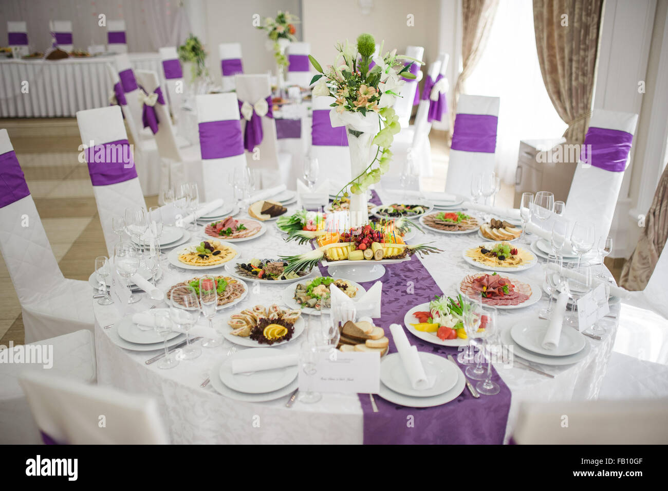 Banquet wedding table setting on evening reception Stock Photo - Alamy