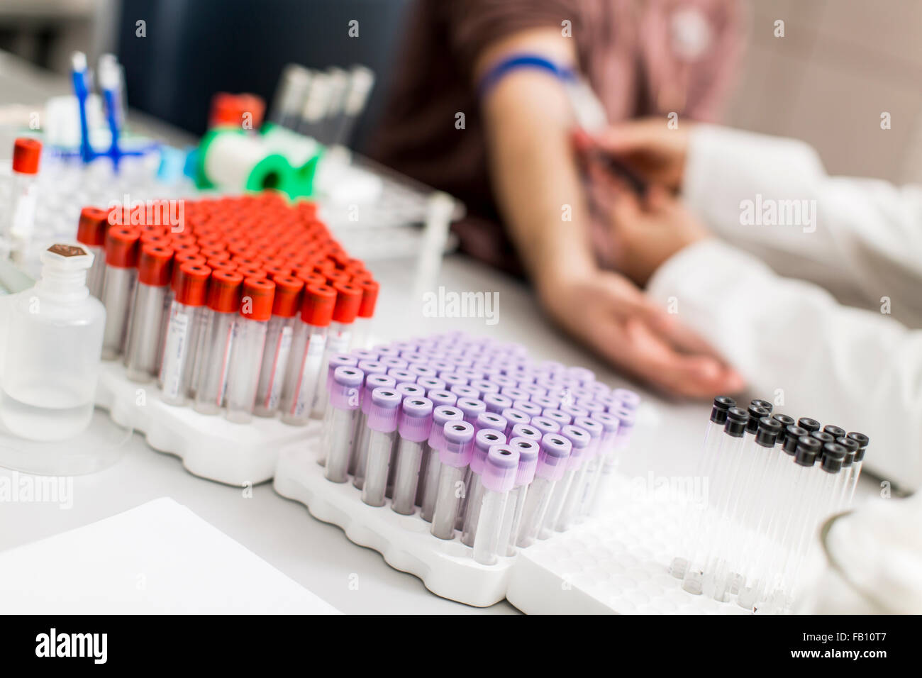 Taking blood in laboratory Stock Photo - Alamy