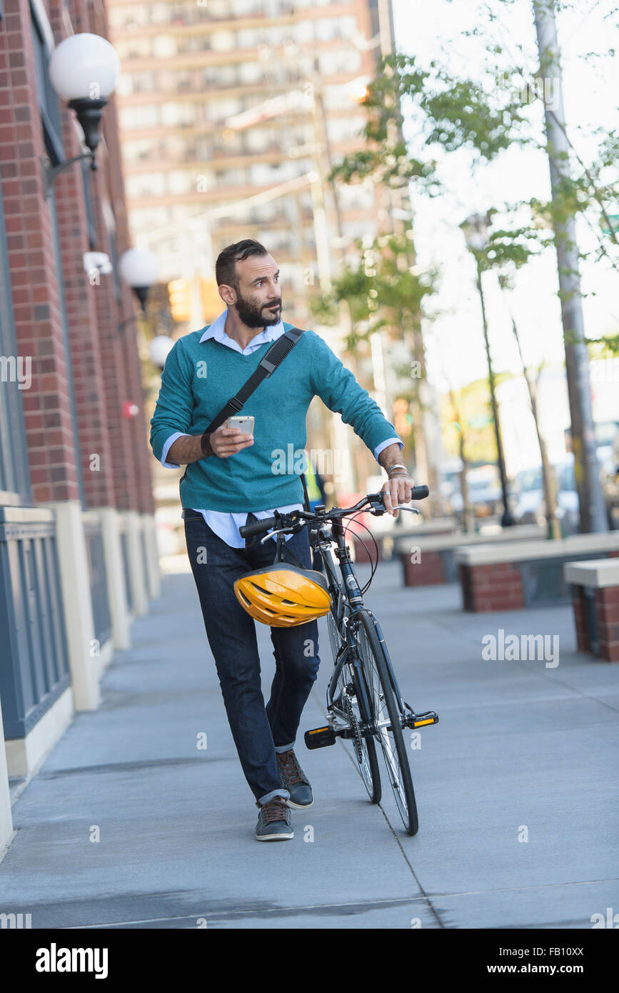 Man walking bicycle using hi-res stock photography and images - Alamy