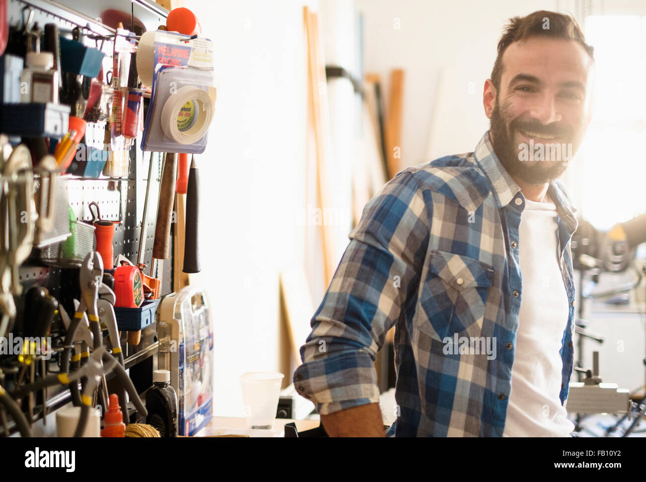 Portrait of man in workshop Stock Photo - Alamy