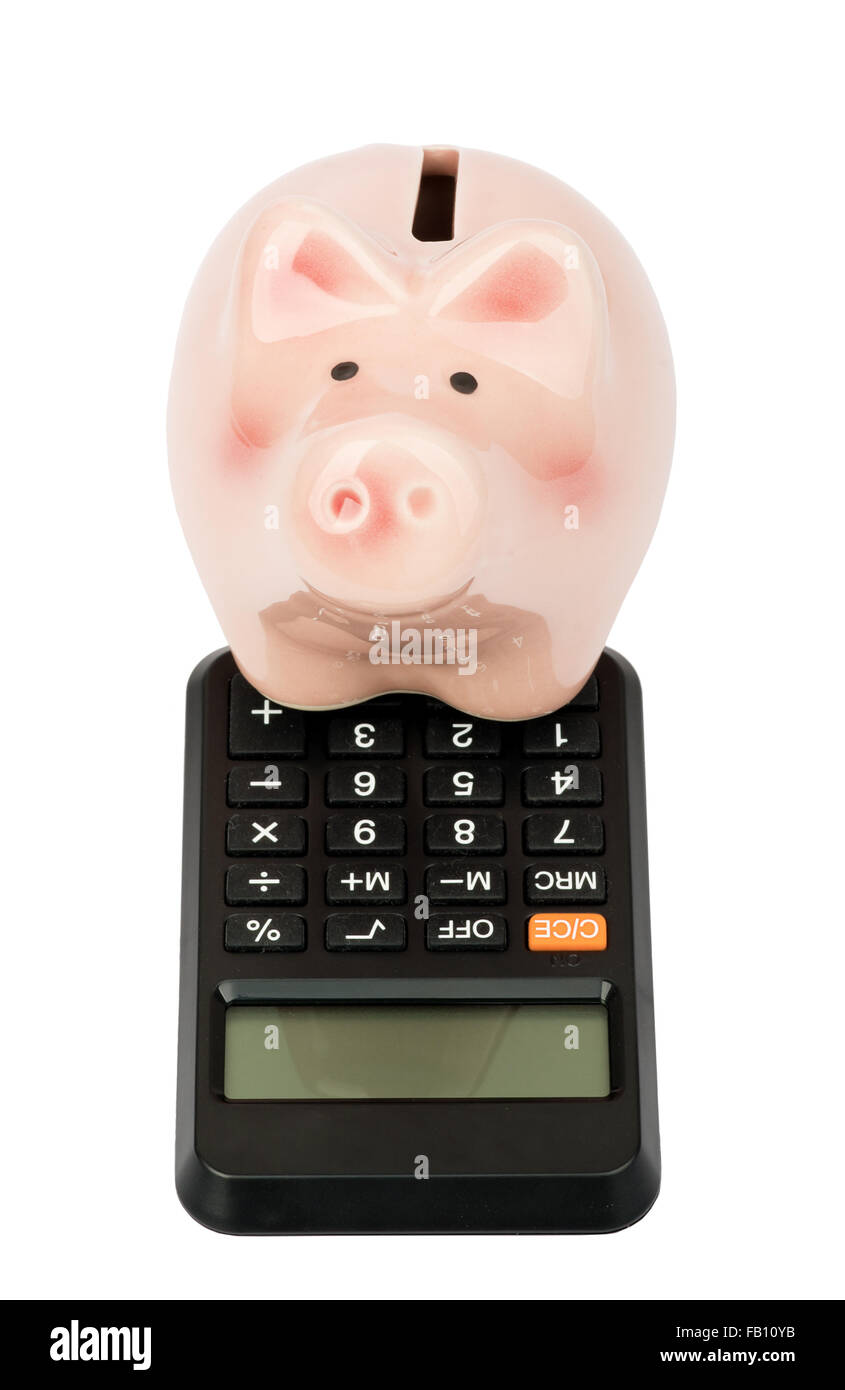 Piggy bank with calculator Stock Photo - Alamy