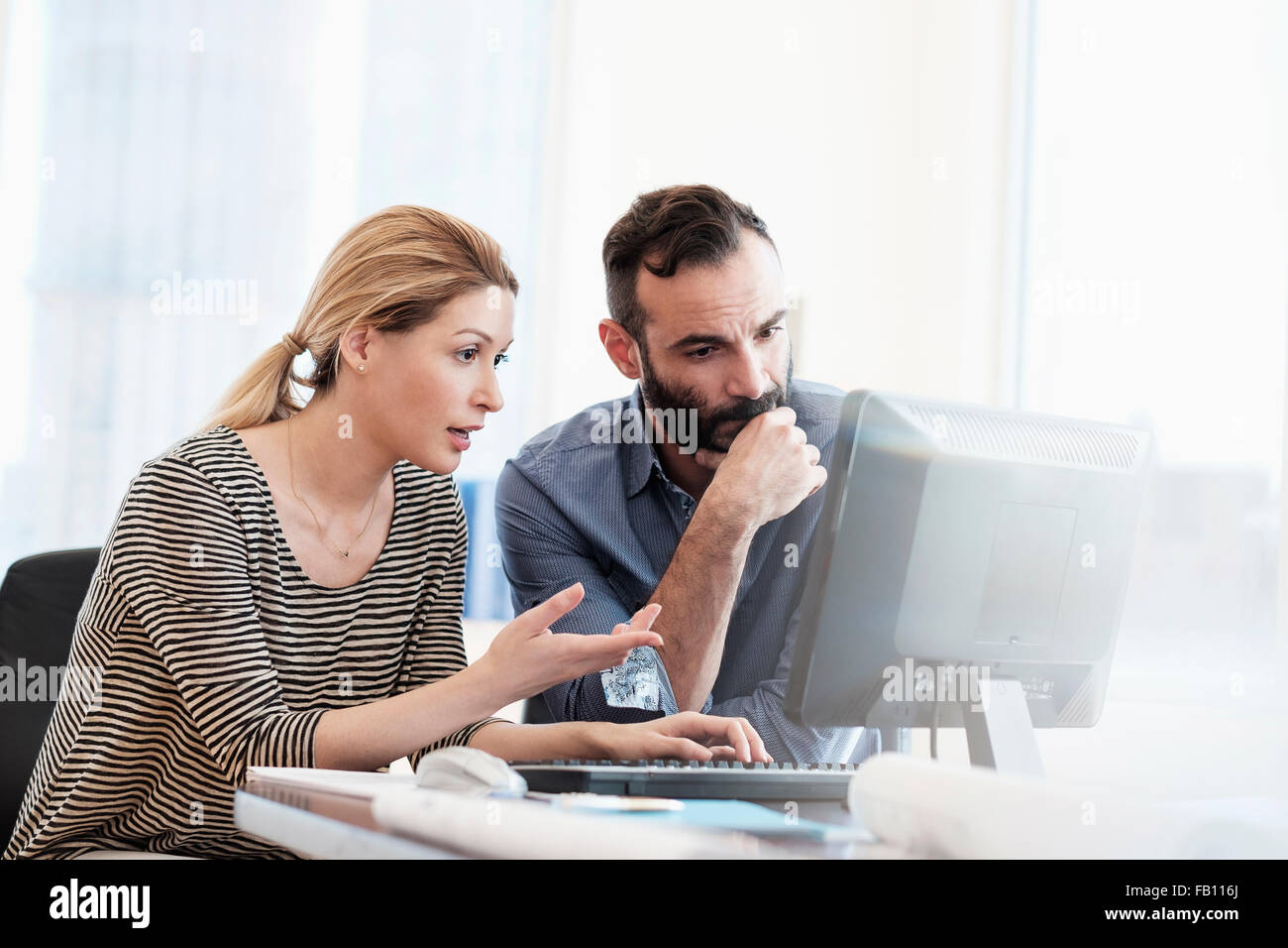 Two people looking at monitor hi-res stock photography and images - Alamy