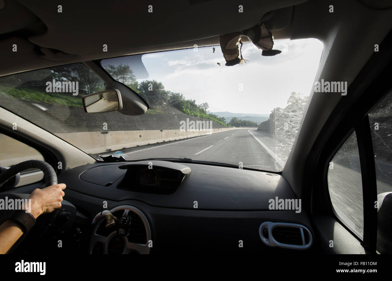 Person driving a car on a highway Stock Photo - Alamy