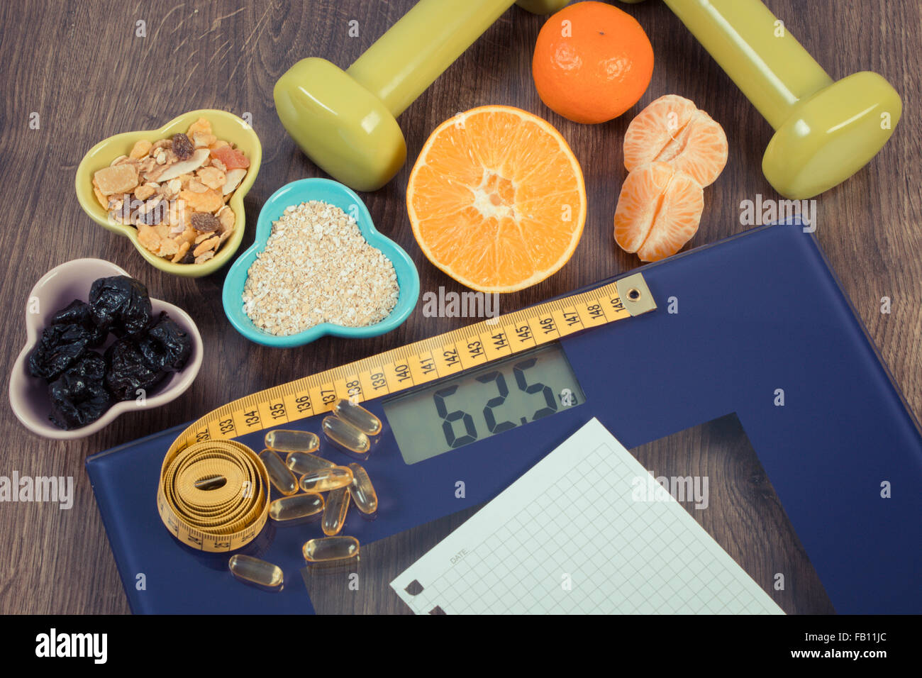Tape measure, tablets supplements on digital scale for weight of human ...