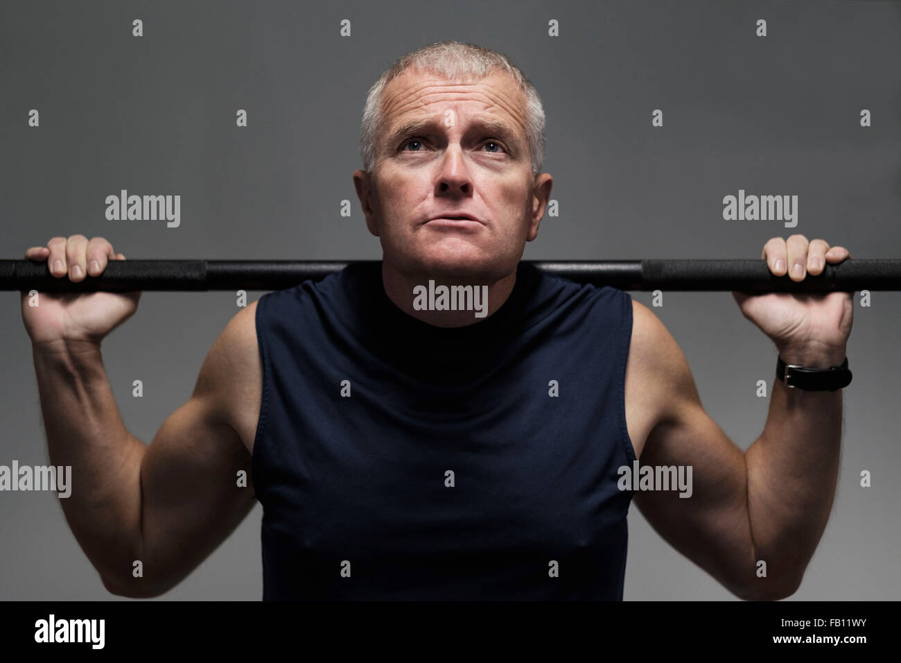 Person exercising lifting weights in hi-res stock photography and ...