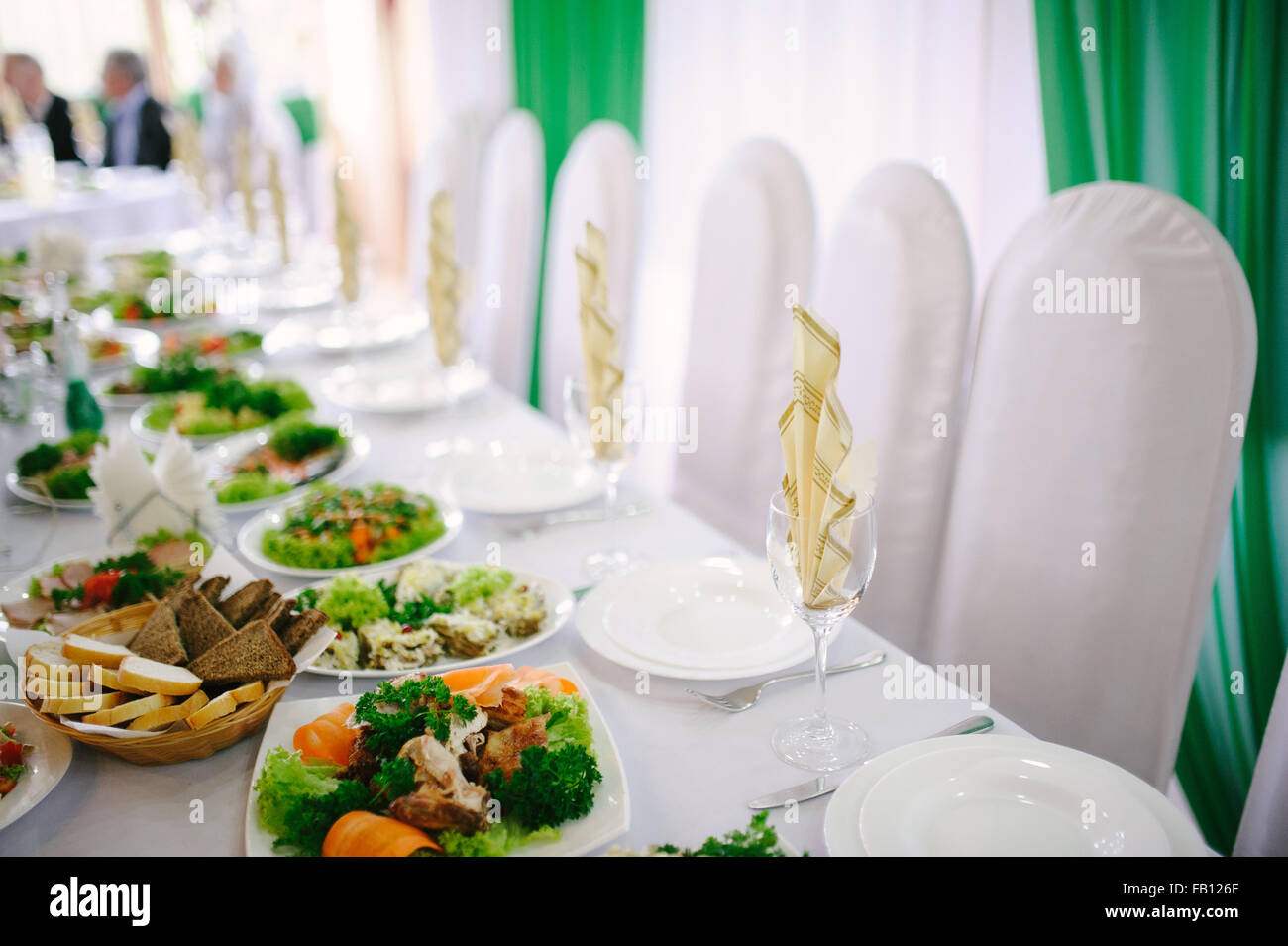 Banquet wedding table setting on evening reception Stock Photo - Alamy