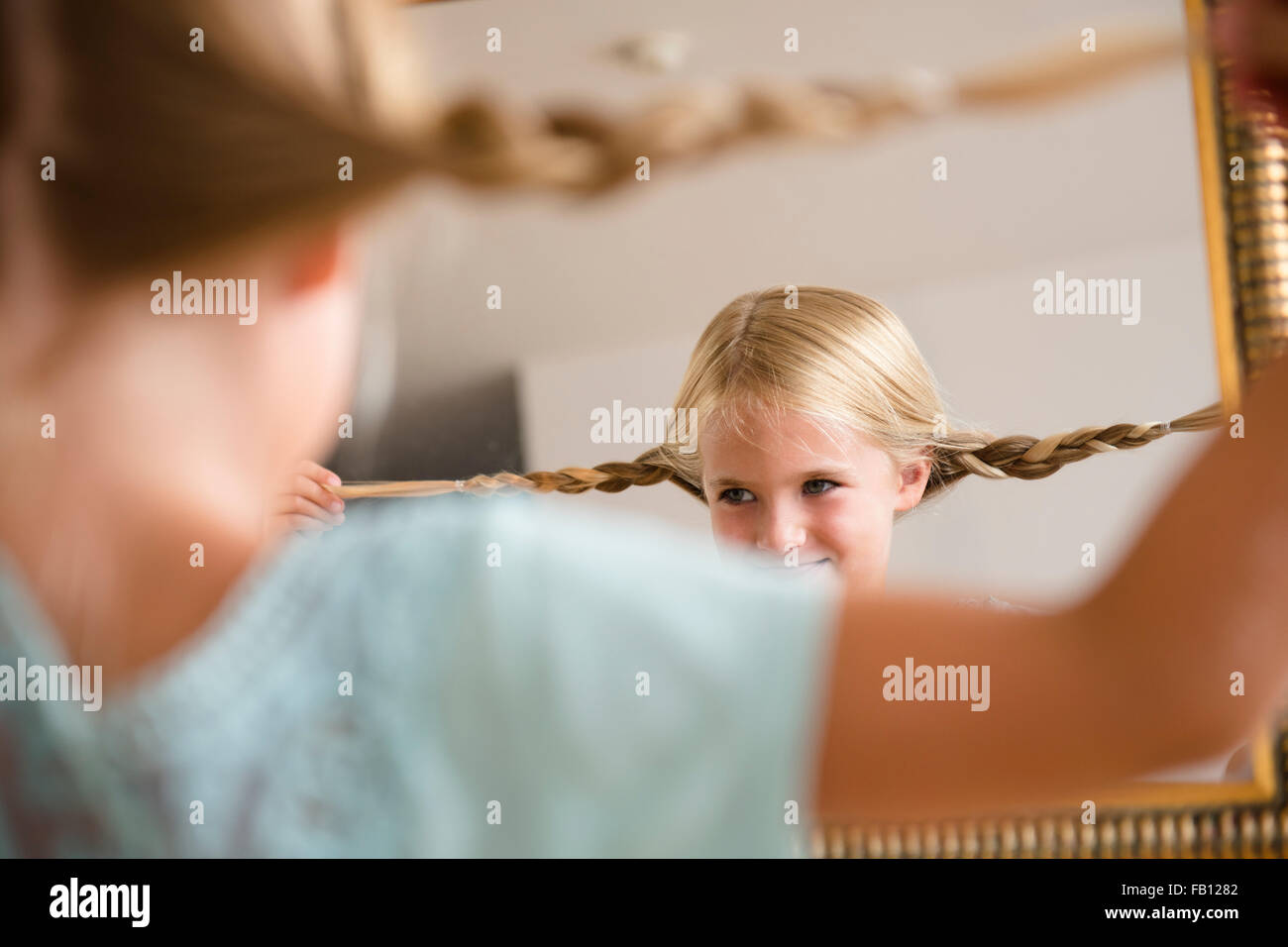 Girl looking in mirror hi-res stock photography and images - Alamy